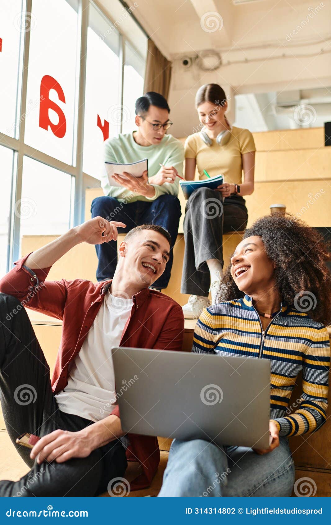 Multicultural Group of Students Collaborating Around Stock Photo ...