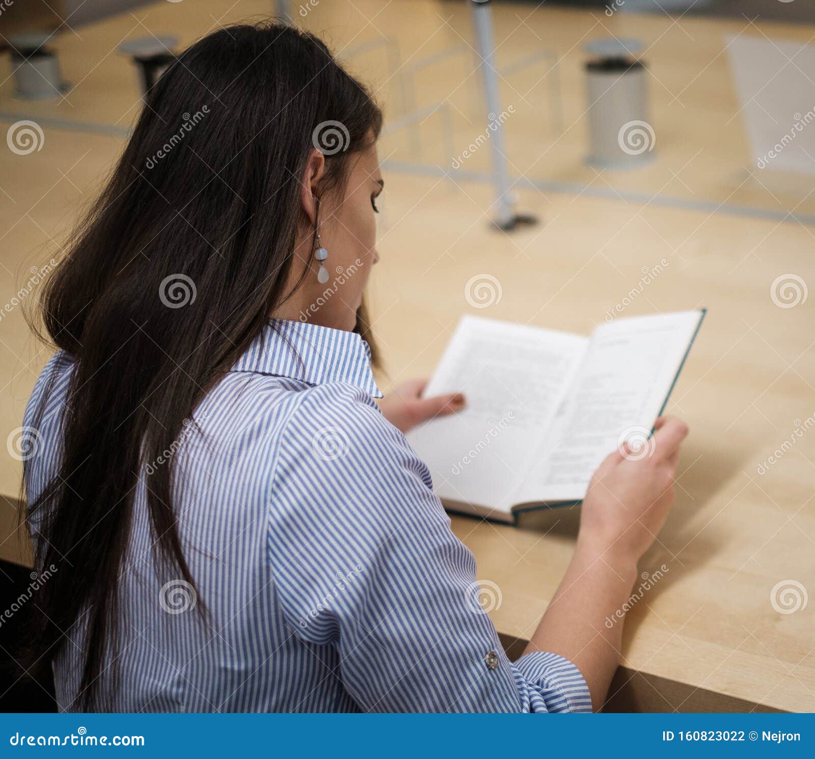 Young Woman Reading Book in Public Library Stock Photo - Image of multi ...