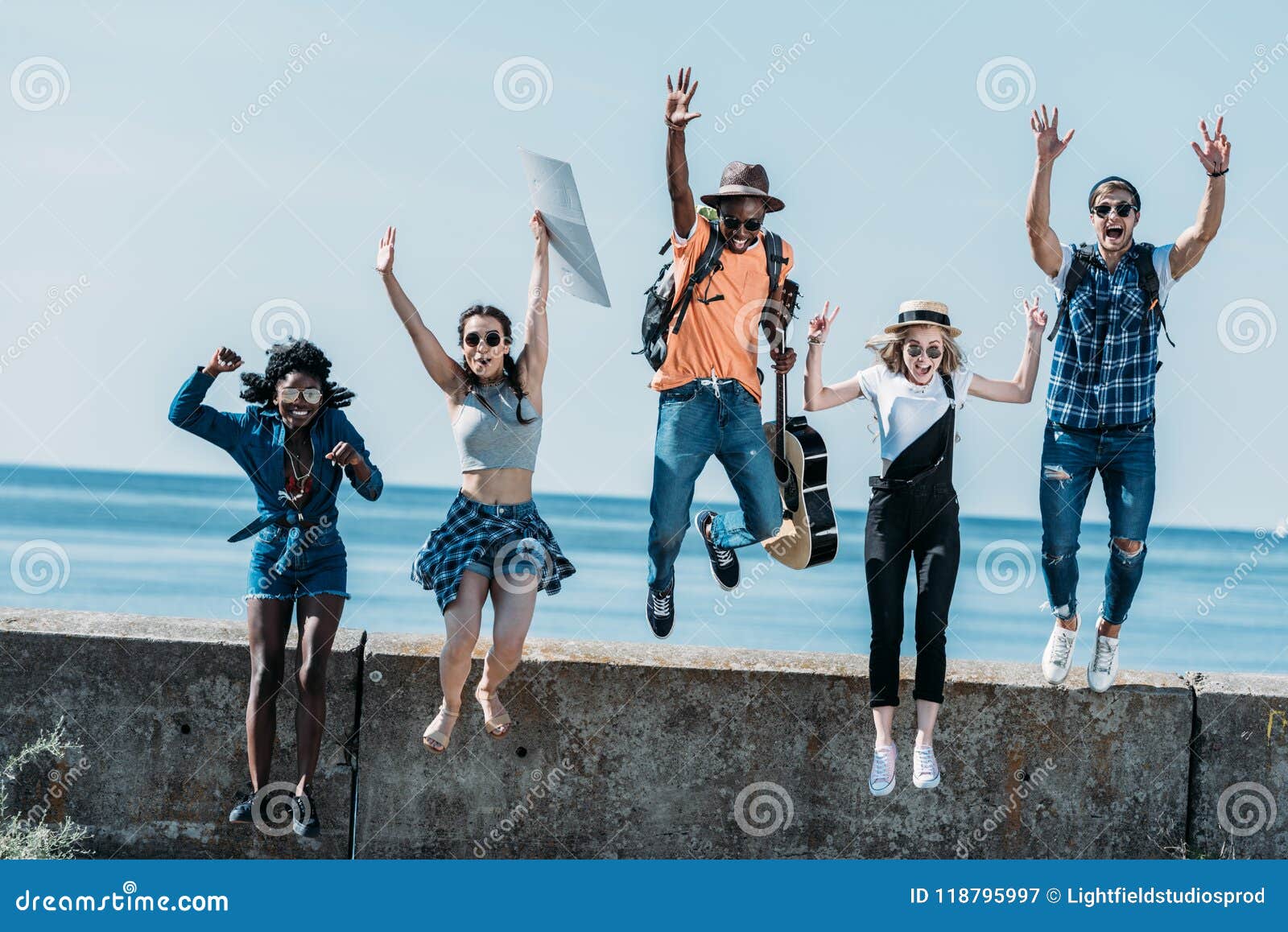 Multicultural Group of Young Friends Jumping of Stock Image - Image of ...