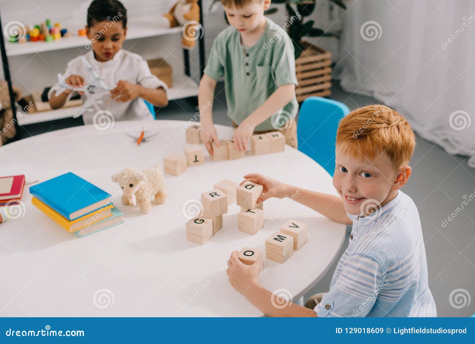 Multicultural Little Boys Plying with Wooden Blocks at Table Stock ...