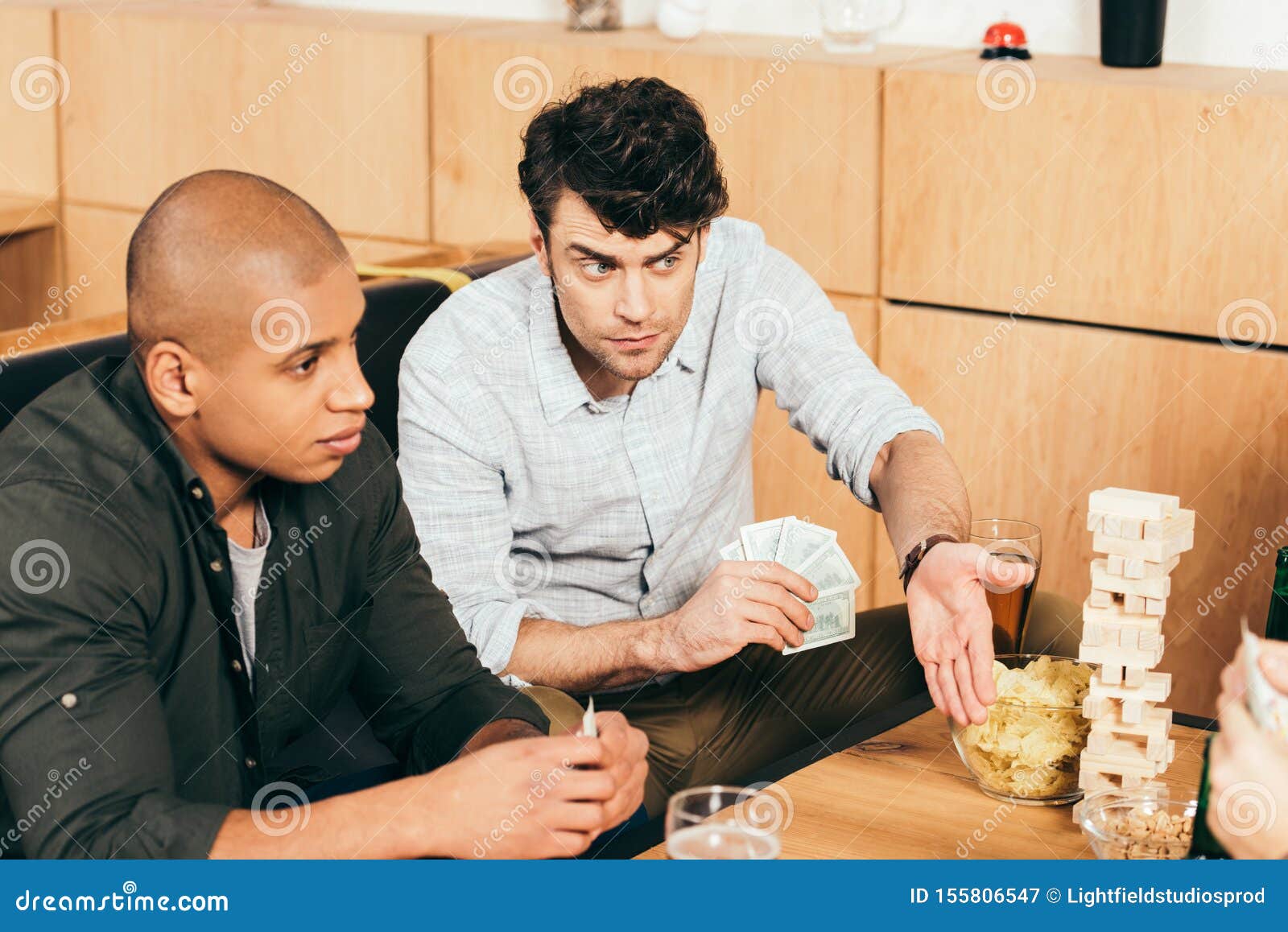 Multicultural Men Playing Cards while Spending Time Together Stock ...