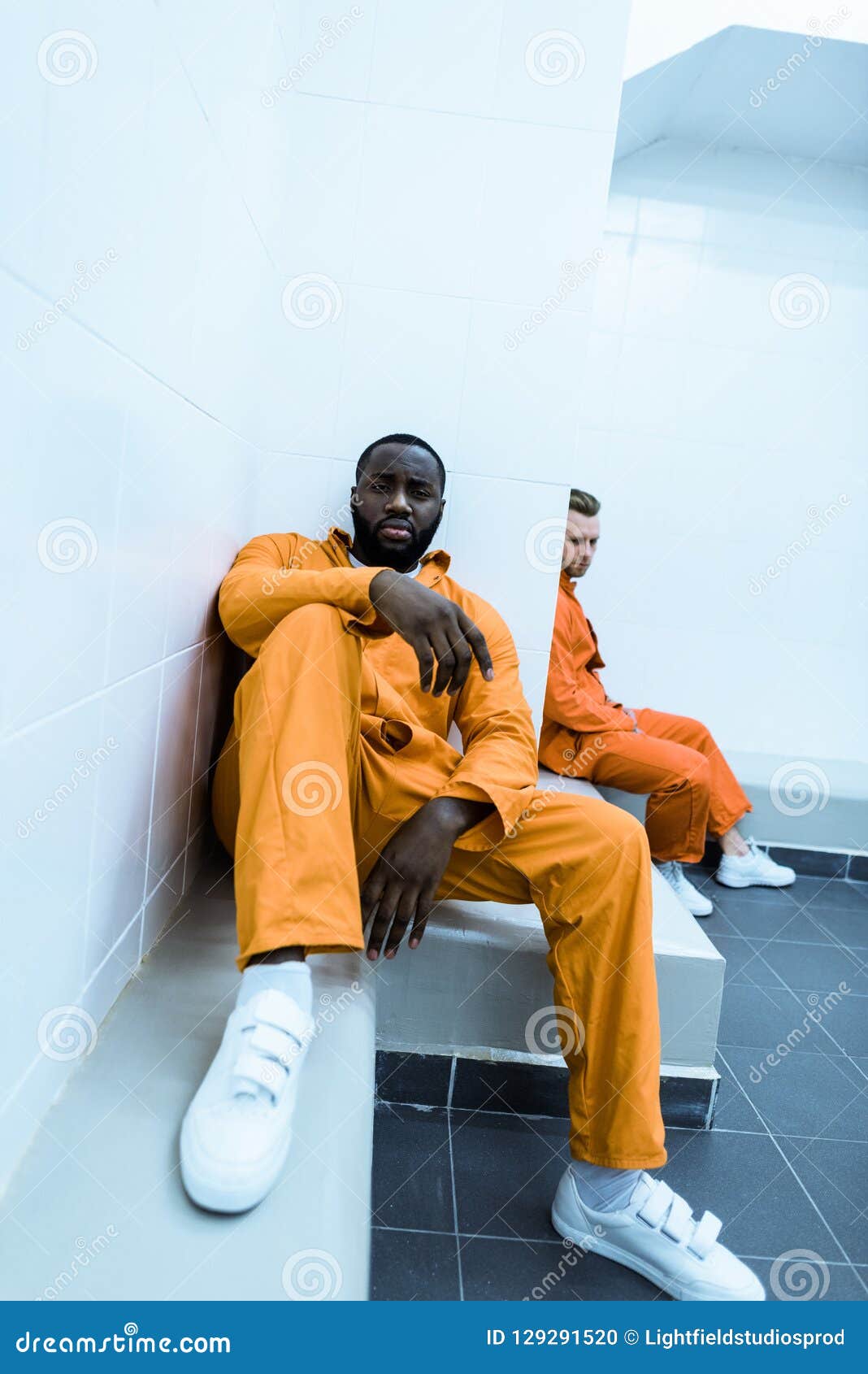 Multicultural Prisoners Sitting on Benches Stock Photo - Image of ...
