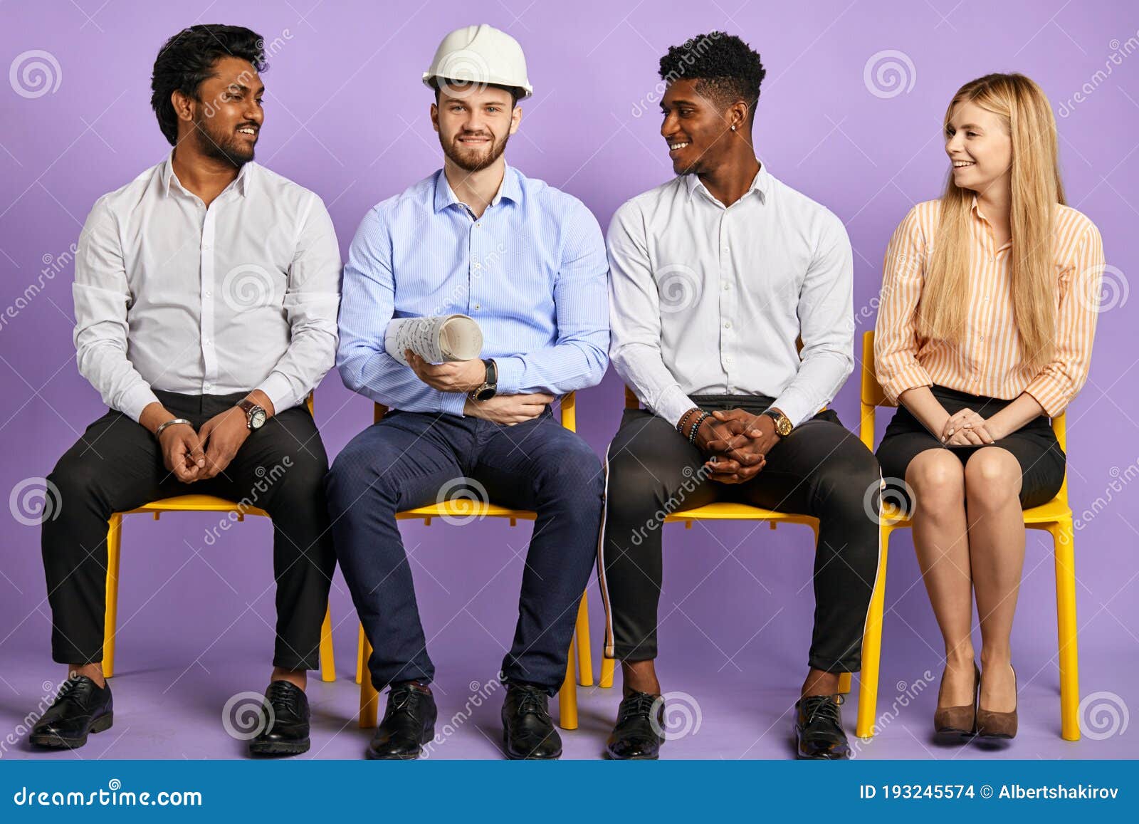 Multicultural Project Team Looking at Construction Engineer Stock Photo ...