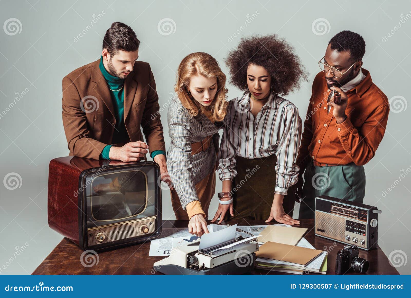 Multicultural Retro Styled Journalists Looking at Typewriter in Office ...