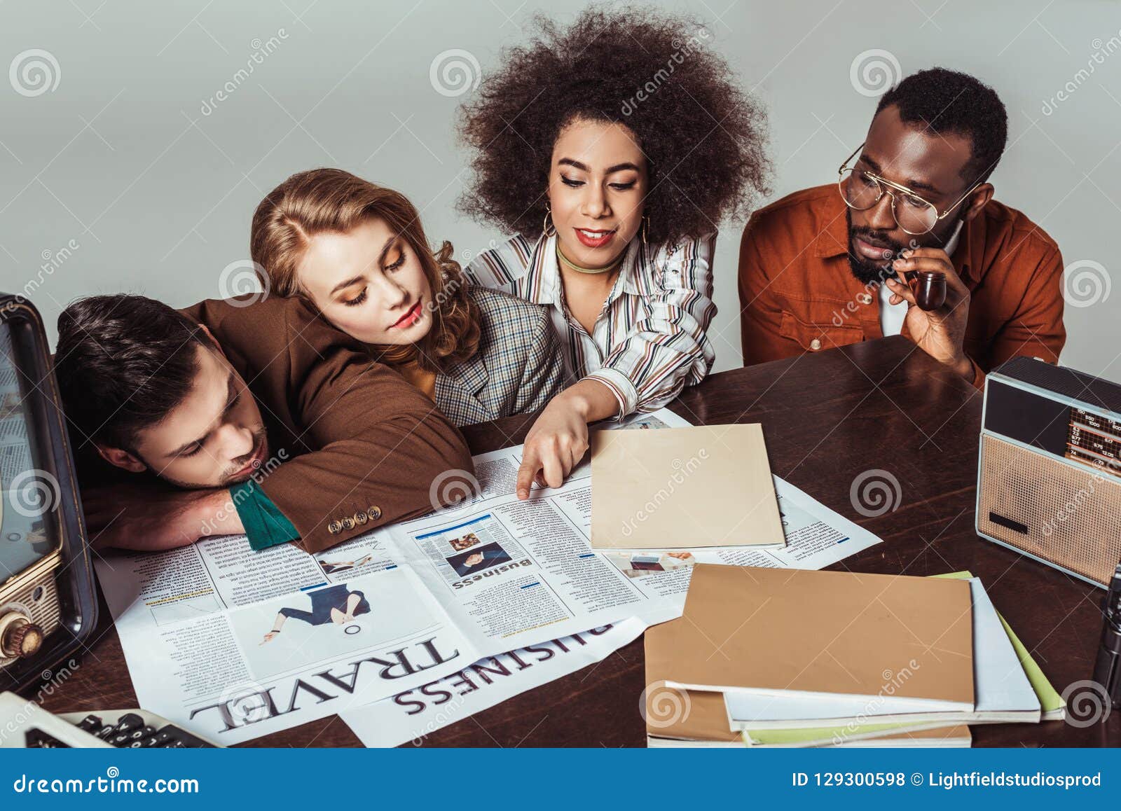 Multicultural Retro Styled Journalists Reading Newspapers Stock Photo ...