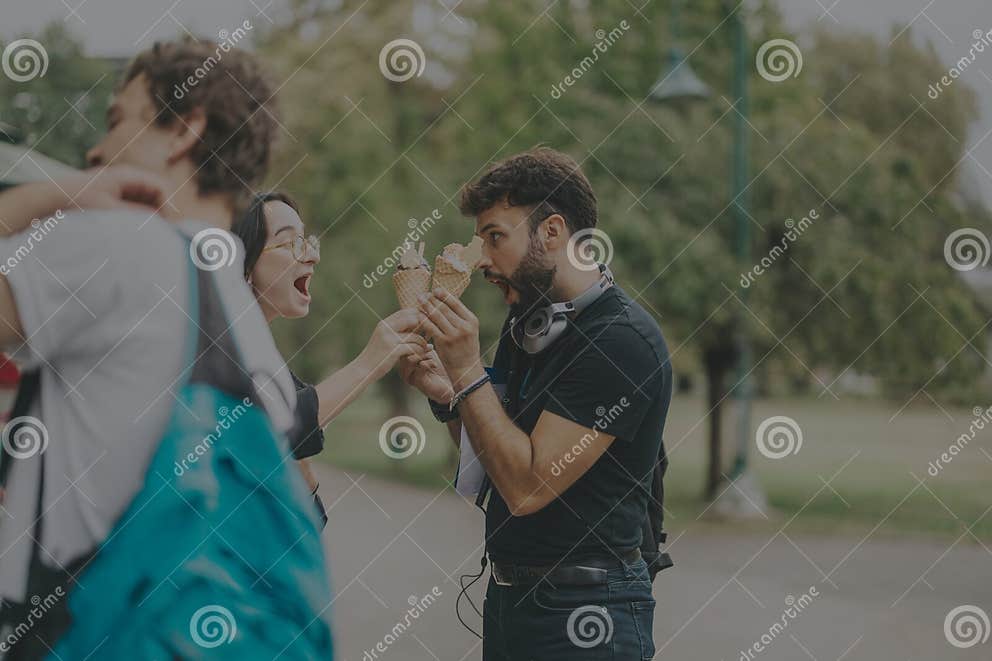 Multicultural Students Enjoying Ice Cream Break at the Park Together ...