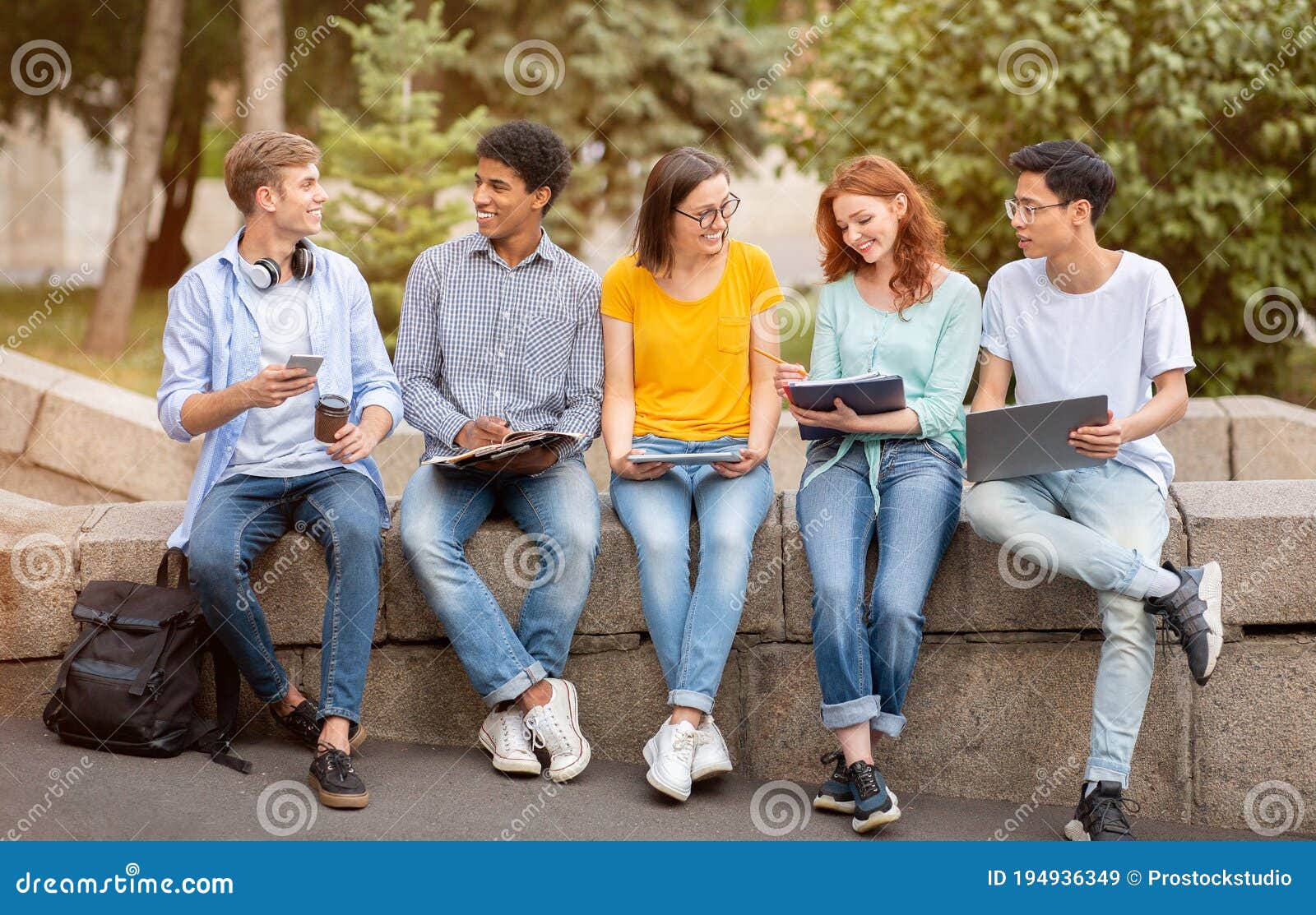 Multicultural Students Learning Together Working on Group Project ...