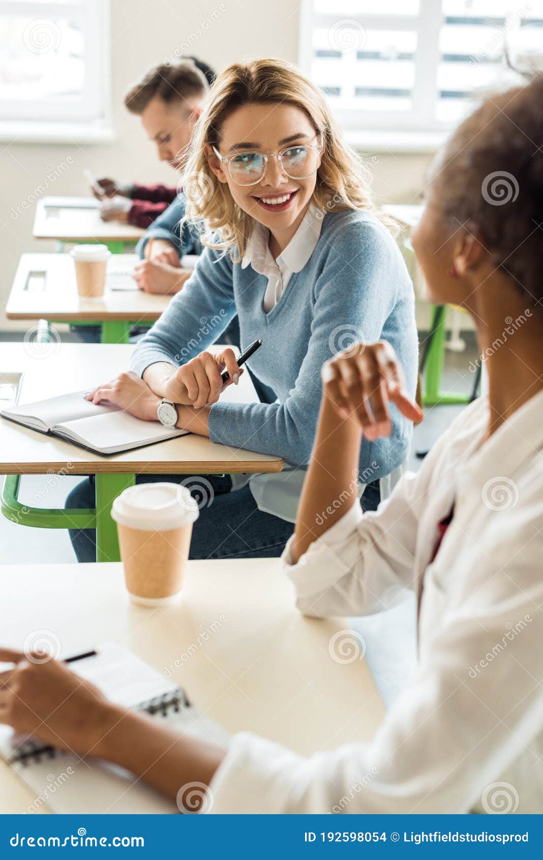 Multicultural Students with Notebooks Talking in College Stock Photo ...