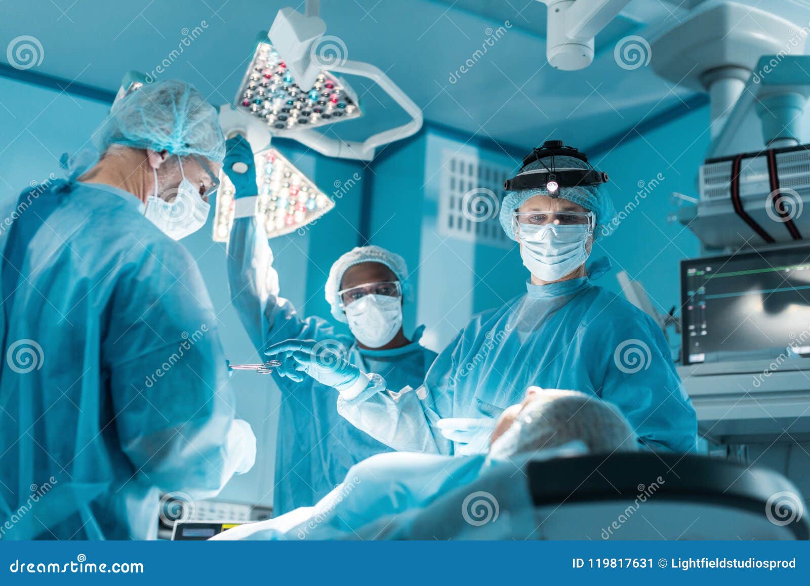 Multicultural Surgeons and Patient during Surgery Stock Image - Image ...