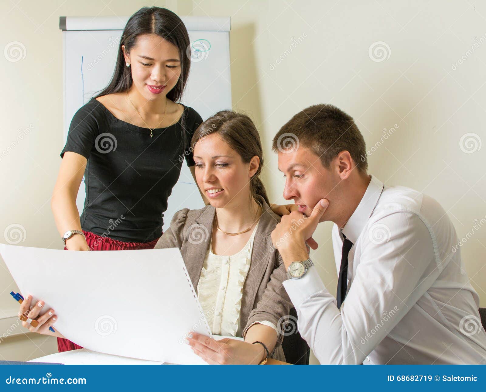 Multicultural Team Looking at a Project Stock Image - Image of ...