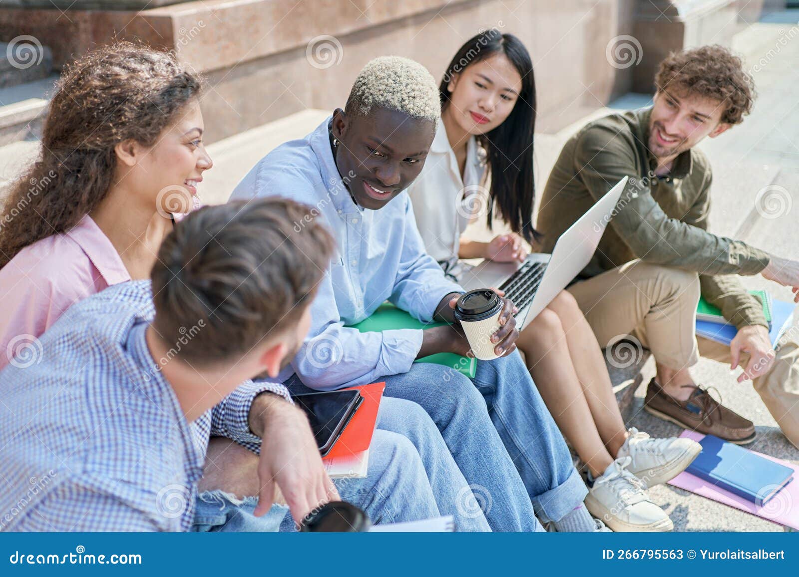 Multicultural Team of Students is Chatting on the Steps of the Campus ...
