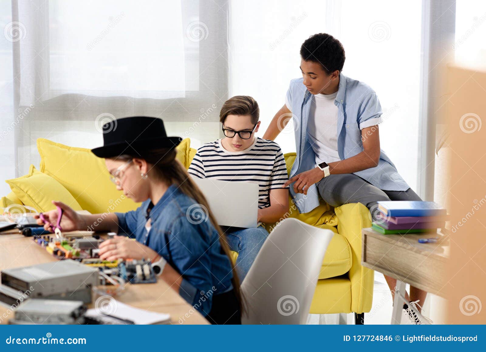 Multicultural Teenagers Studying with Laptop and Computer Motherboard ...