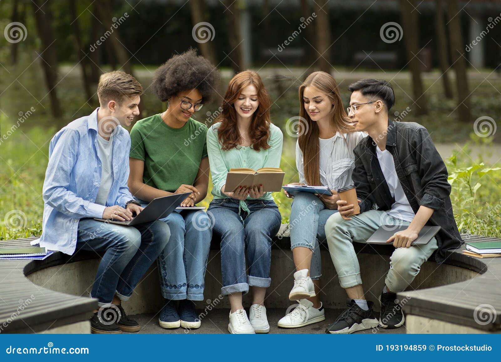 Multicultural University Students Studying Outdoors with Books and ...