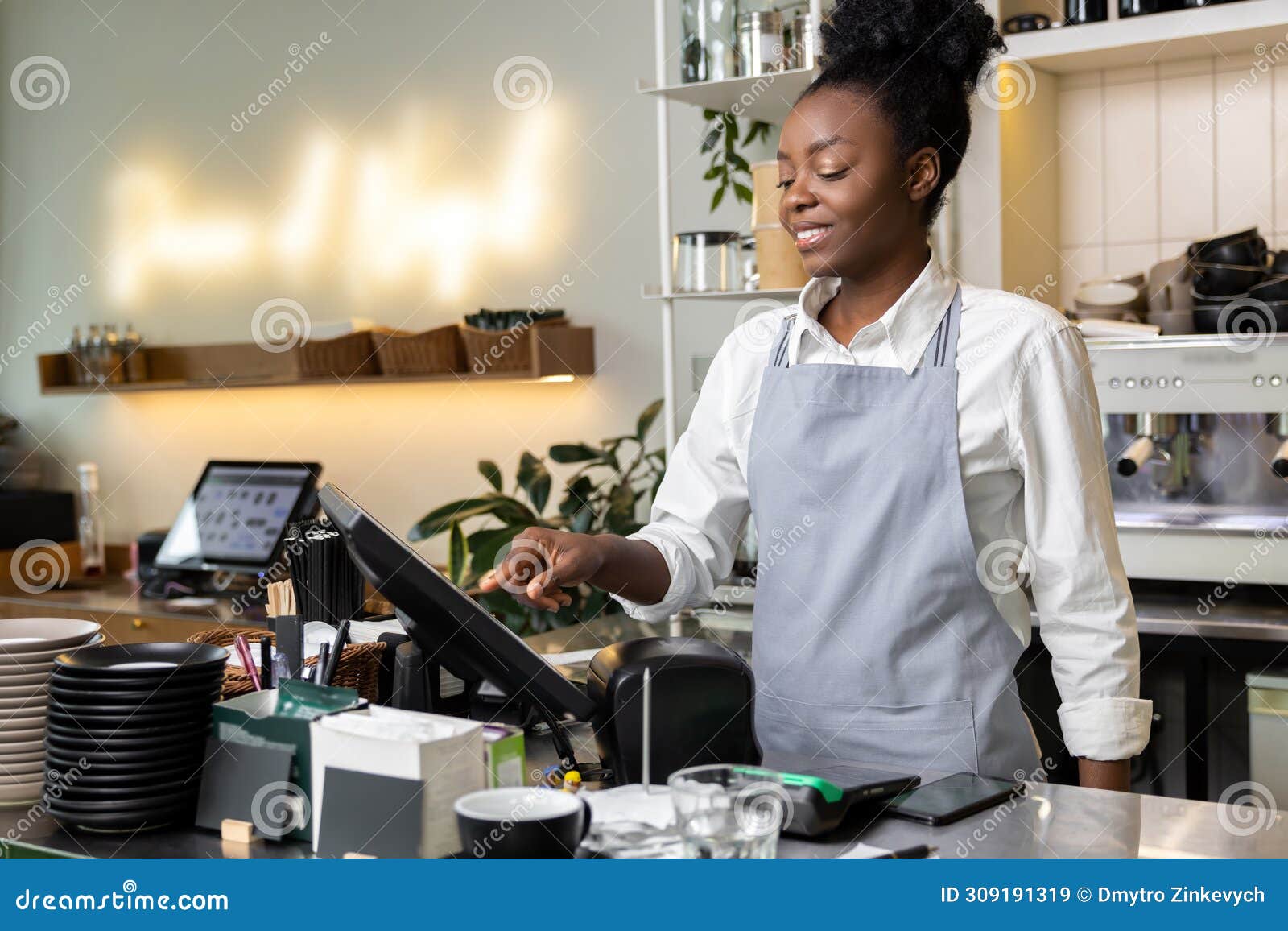 Multicultural Woman Waiter Standing at Cafe Counter Using Terminal ...