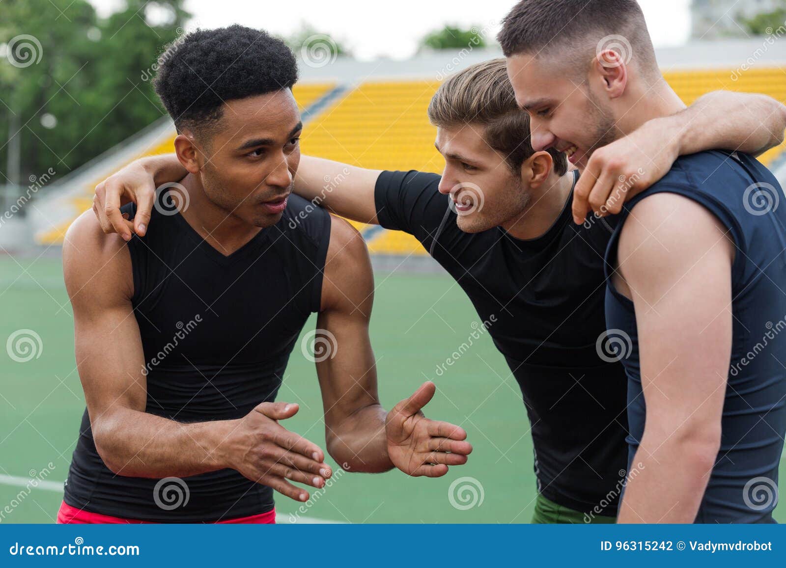 Multiethnic Athlete Group Talking with Each Other on Running Track ...