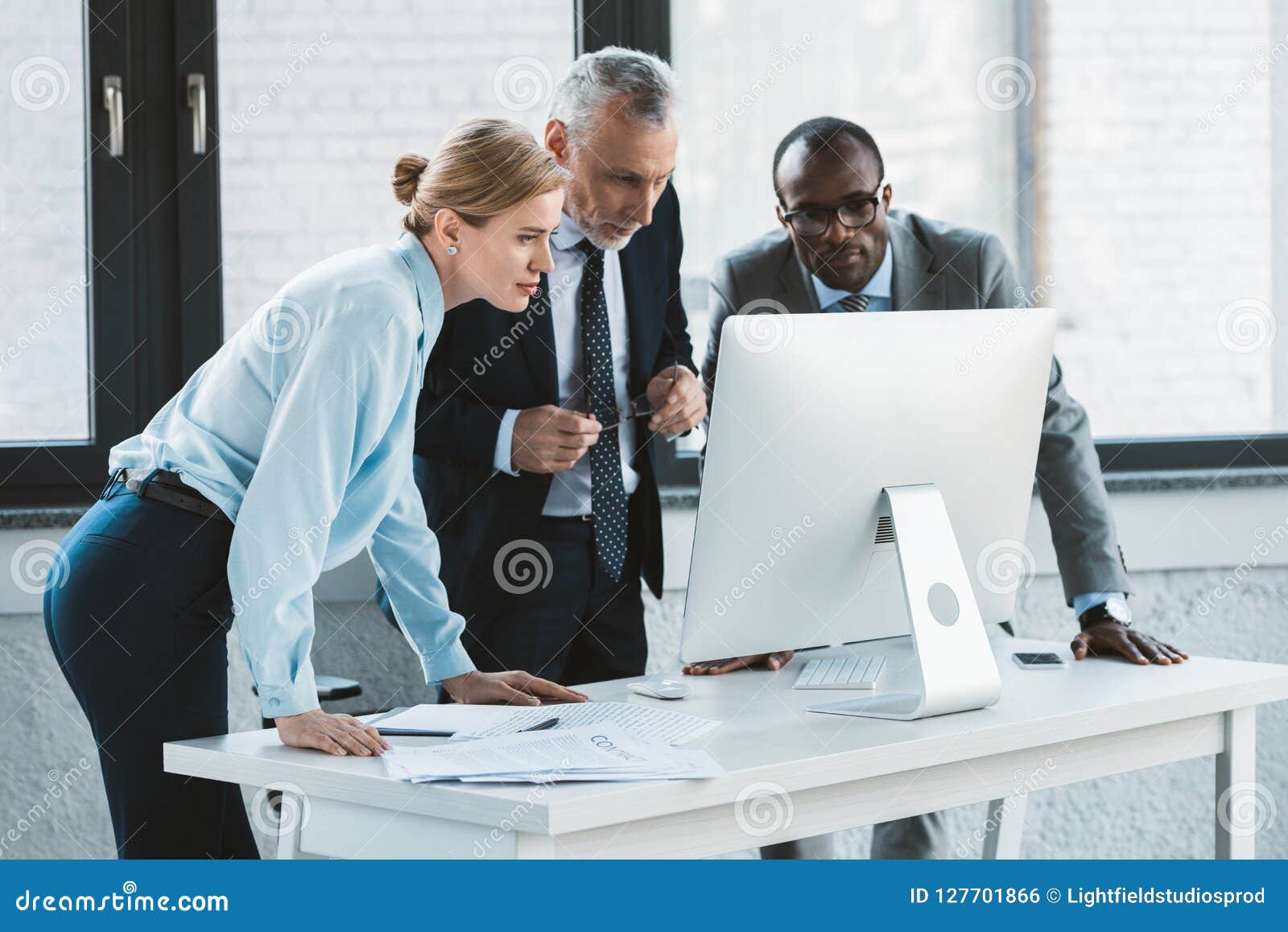 Multiethnic Business Colleagues Looking at Desktop Computer Stock Photo ...