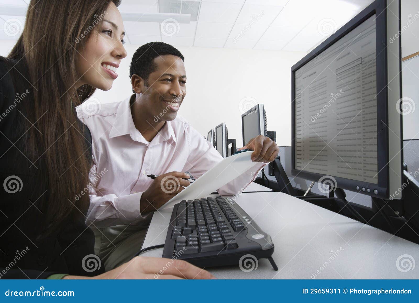Multiethnic Colleagues Working on Computer Together Stock Image - Image ...