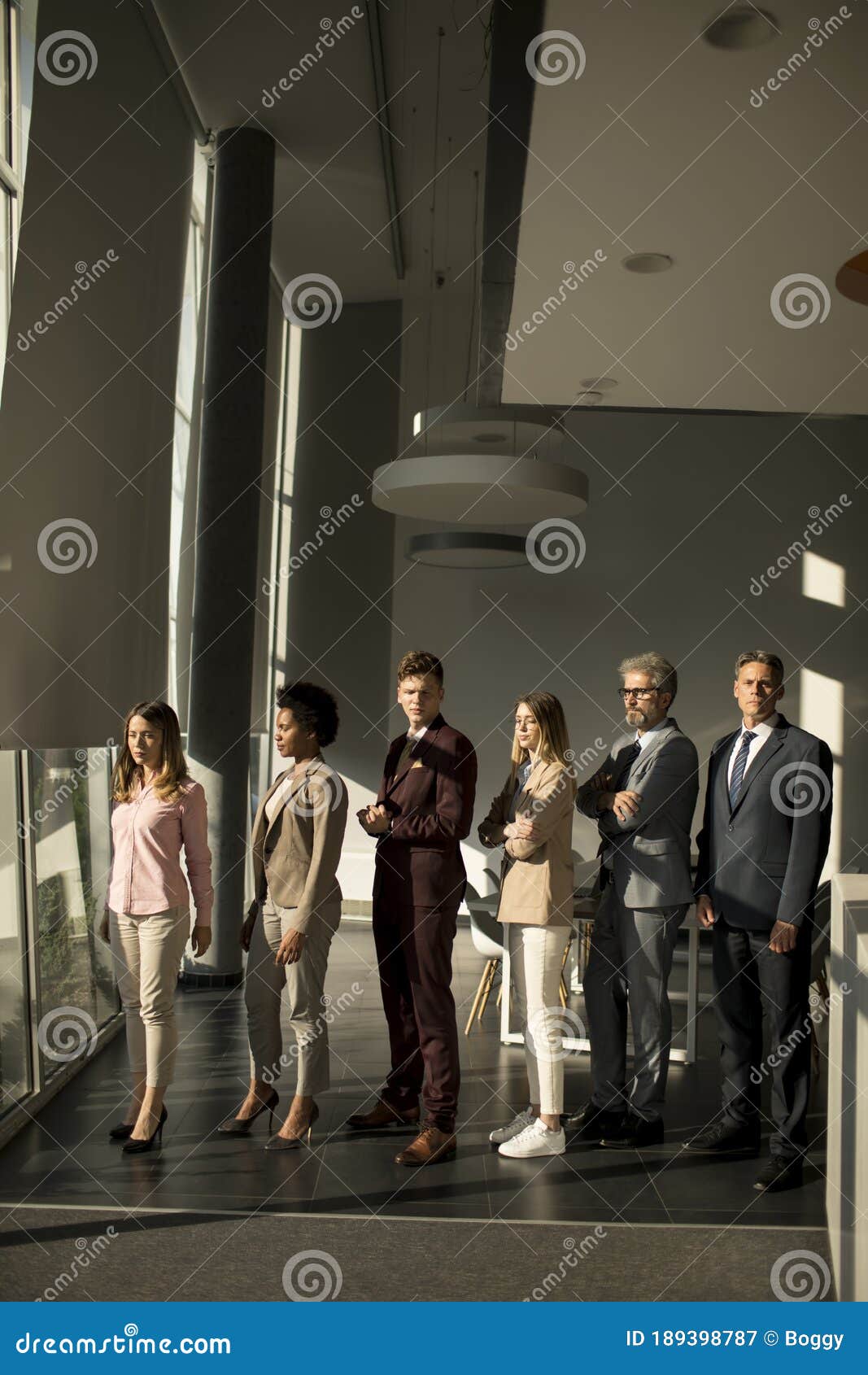 Multiethnic Corporate Staff Standing in Row and Looking in the Camera ...