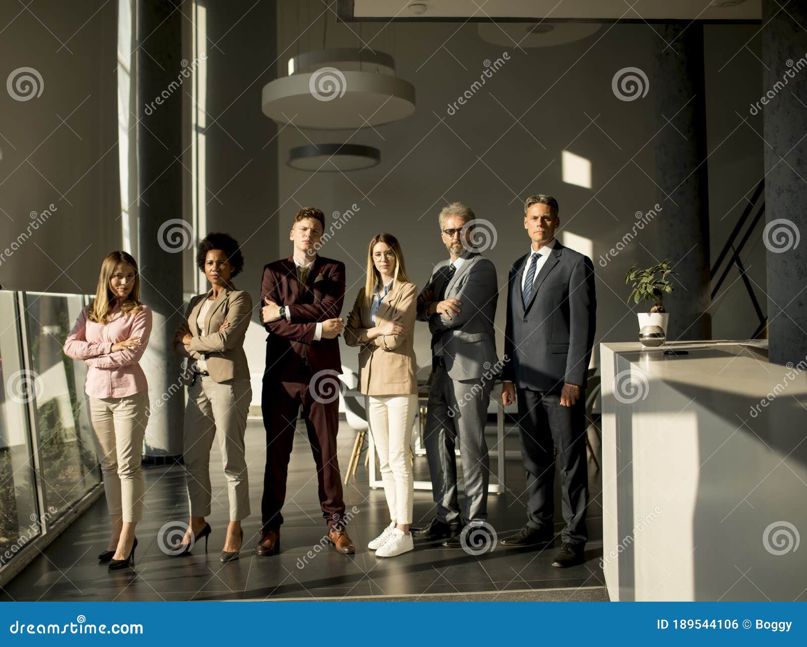 Multiethnic Corporate Staff Standing in Row and Looking in the Camera ...