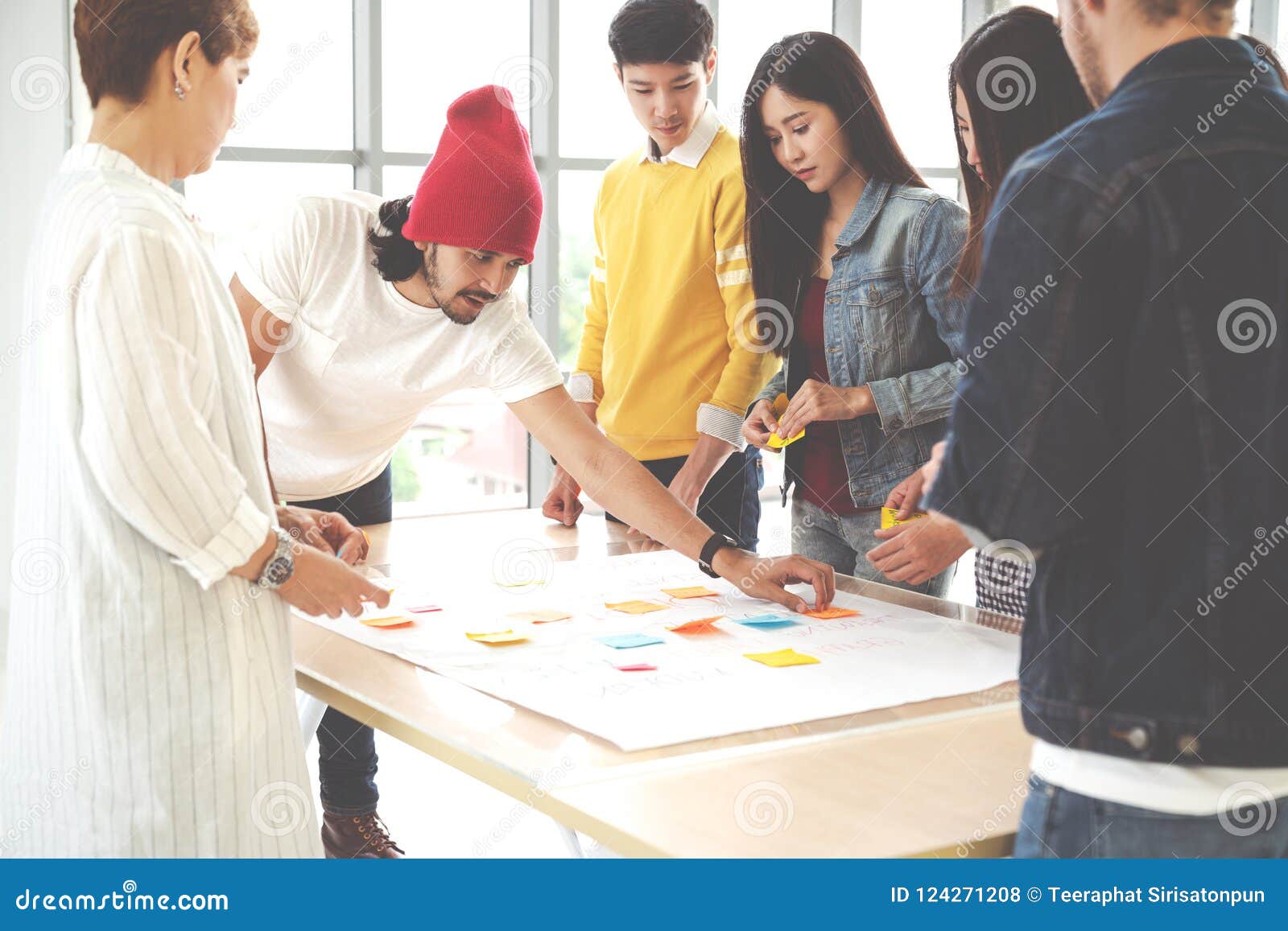 Multiethnic Creative Team Working Together, Meeting and Brainstorming on Table in Workplace ...