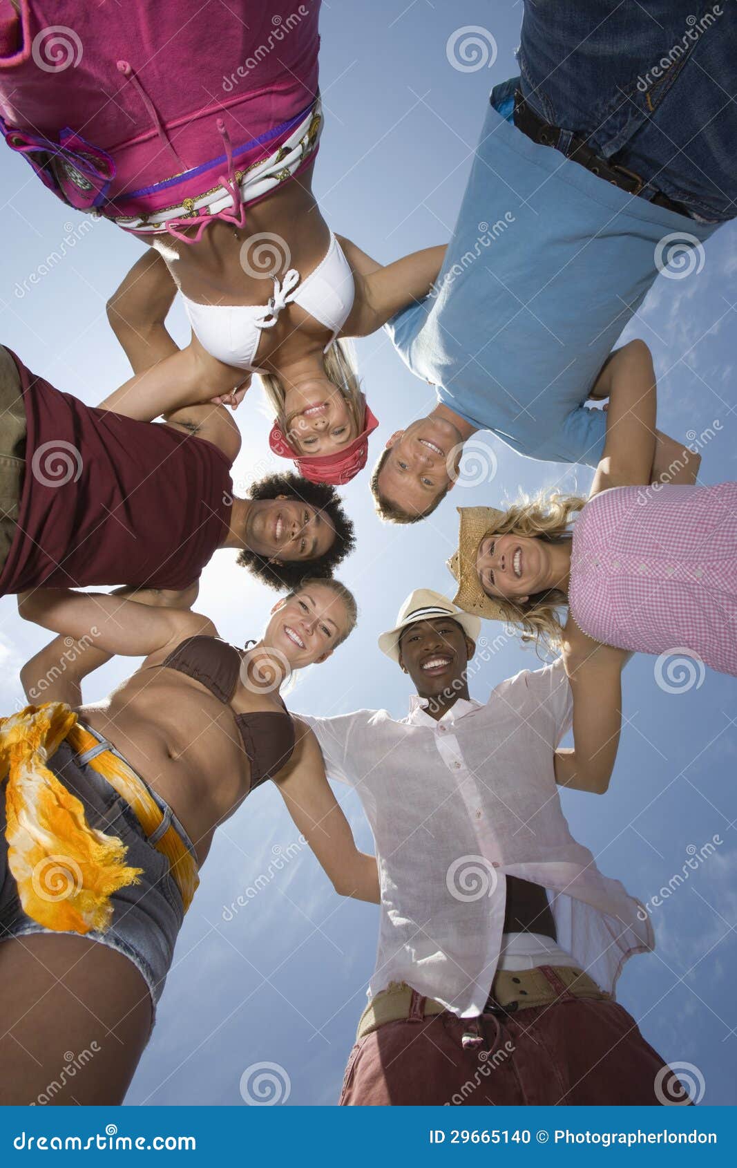 Multiethnic Friends Forming Huddle Stock Photo - Image of angle, circle ...