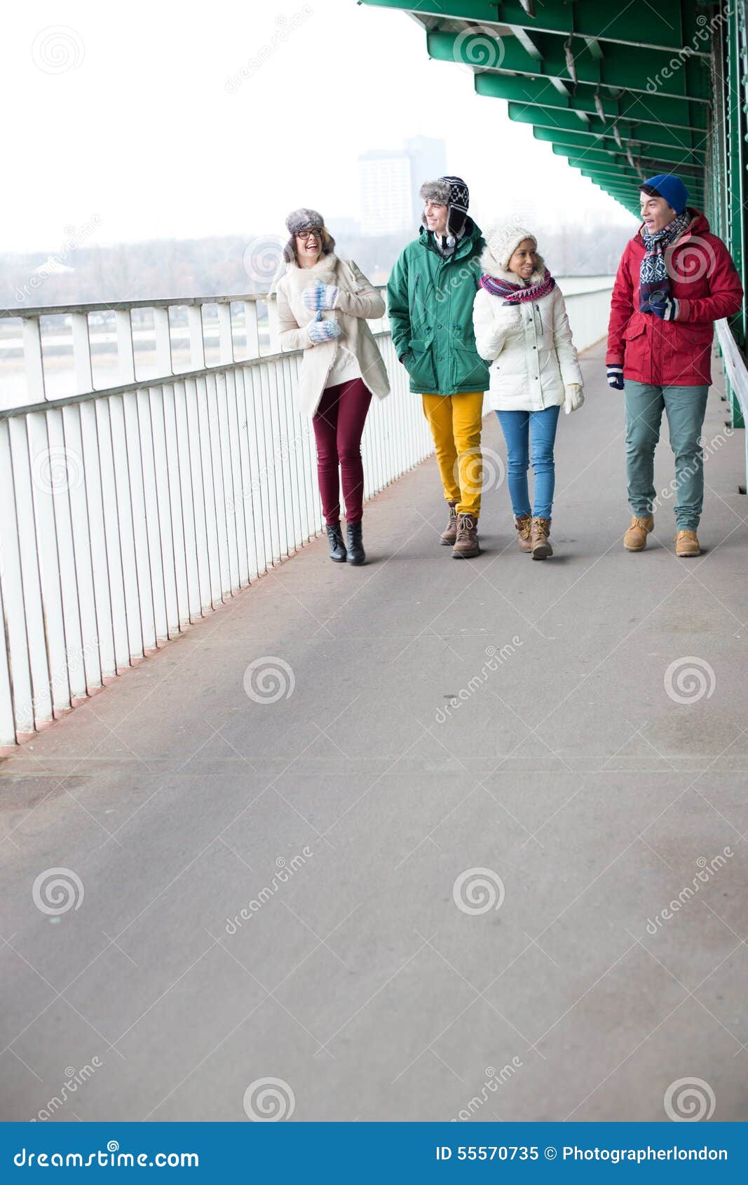 Multiethnic Friends Walking on Footpath during Winter Stock Image ...