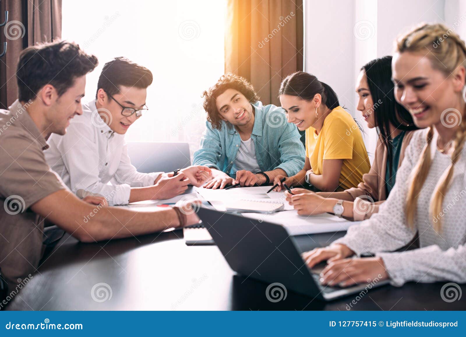 Multiethnic Group of Business Colleagues Having Discussion at Table ...