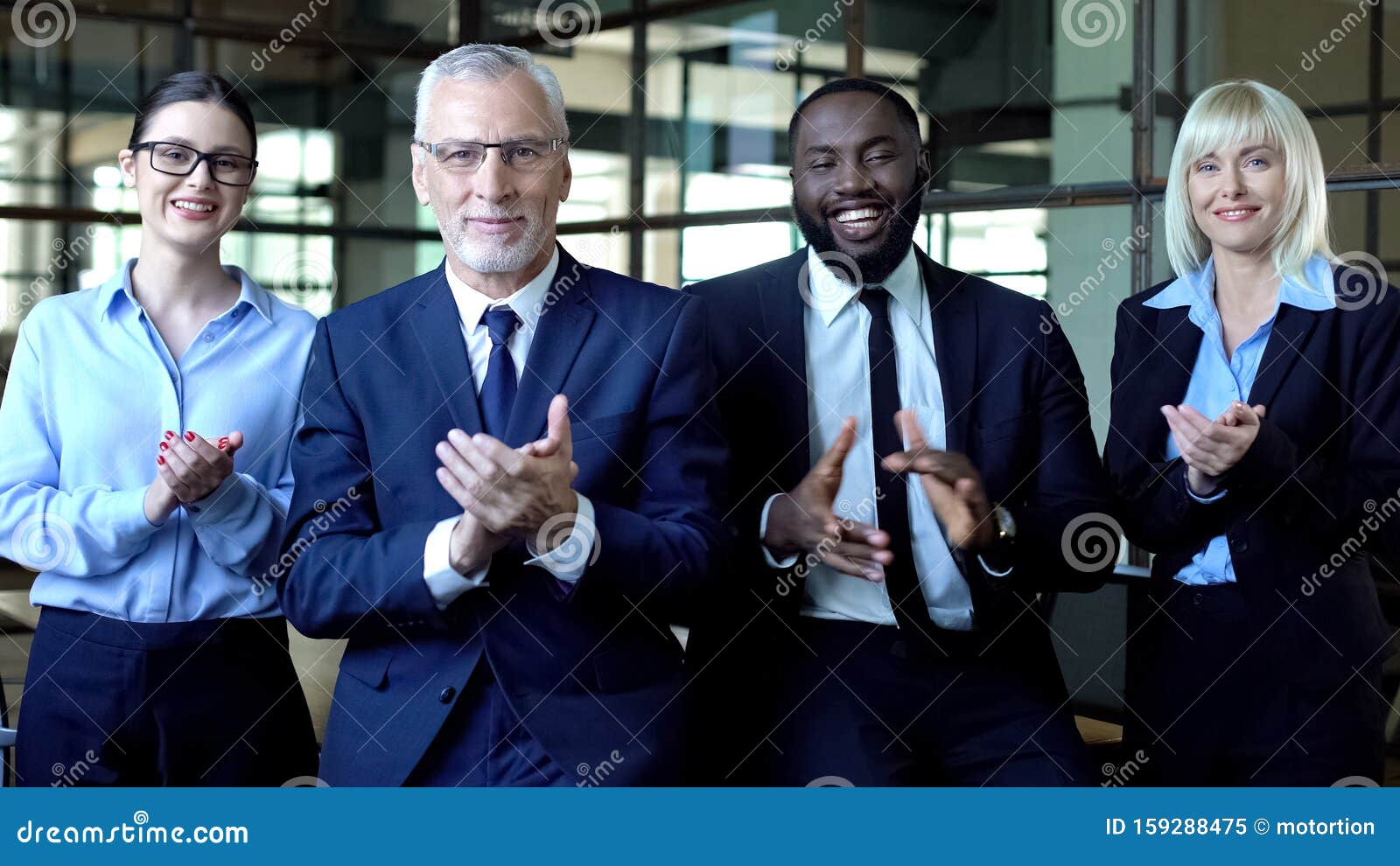 Multiethnic Group of Business People Applauding Looking Camera ... Multiethnic Group of Business People Applauding Looking Camera ...