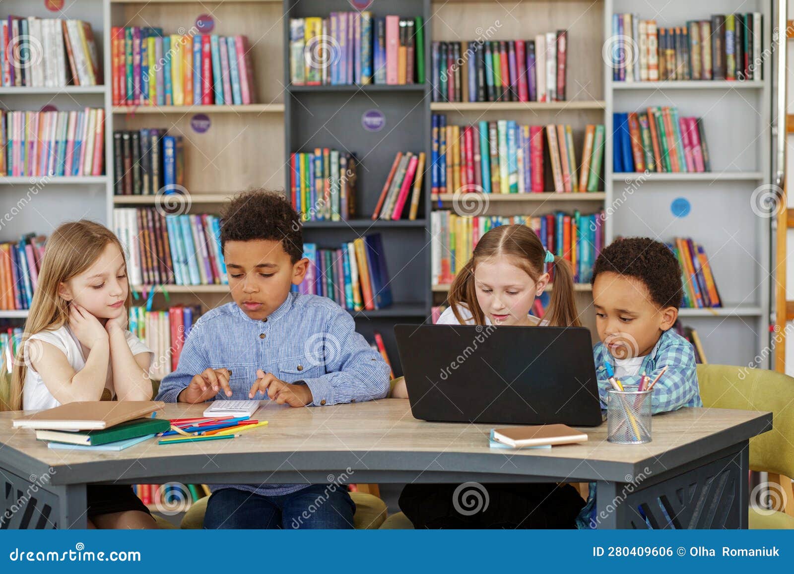 Multiracial Group of Children Sitting in Row at School Classroom and ...