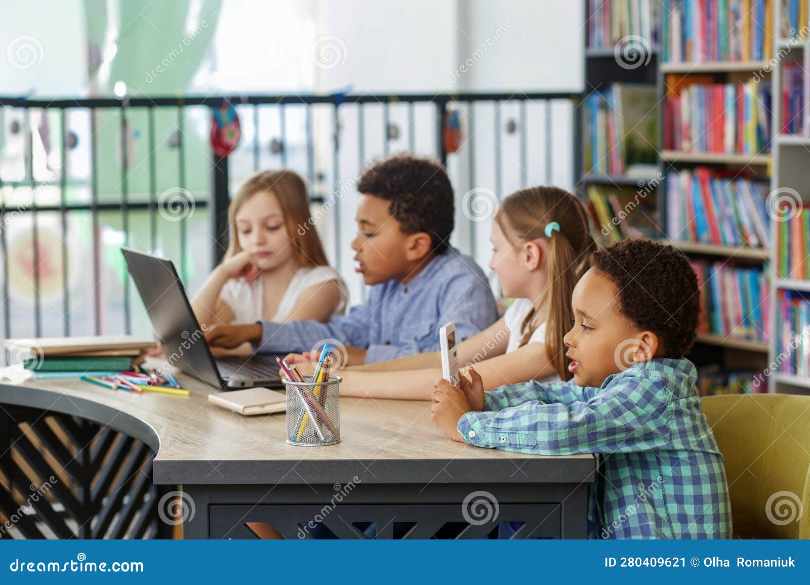 Multiracial Group of Children Sitting in Row at School Classroom and ...