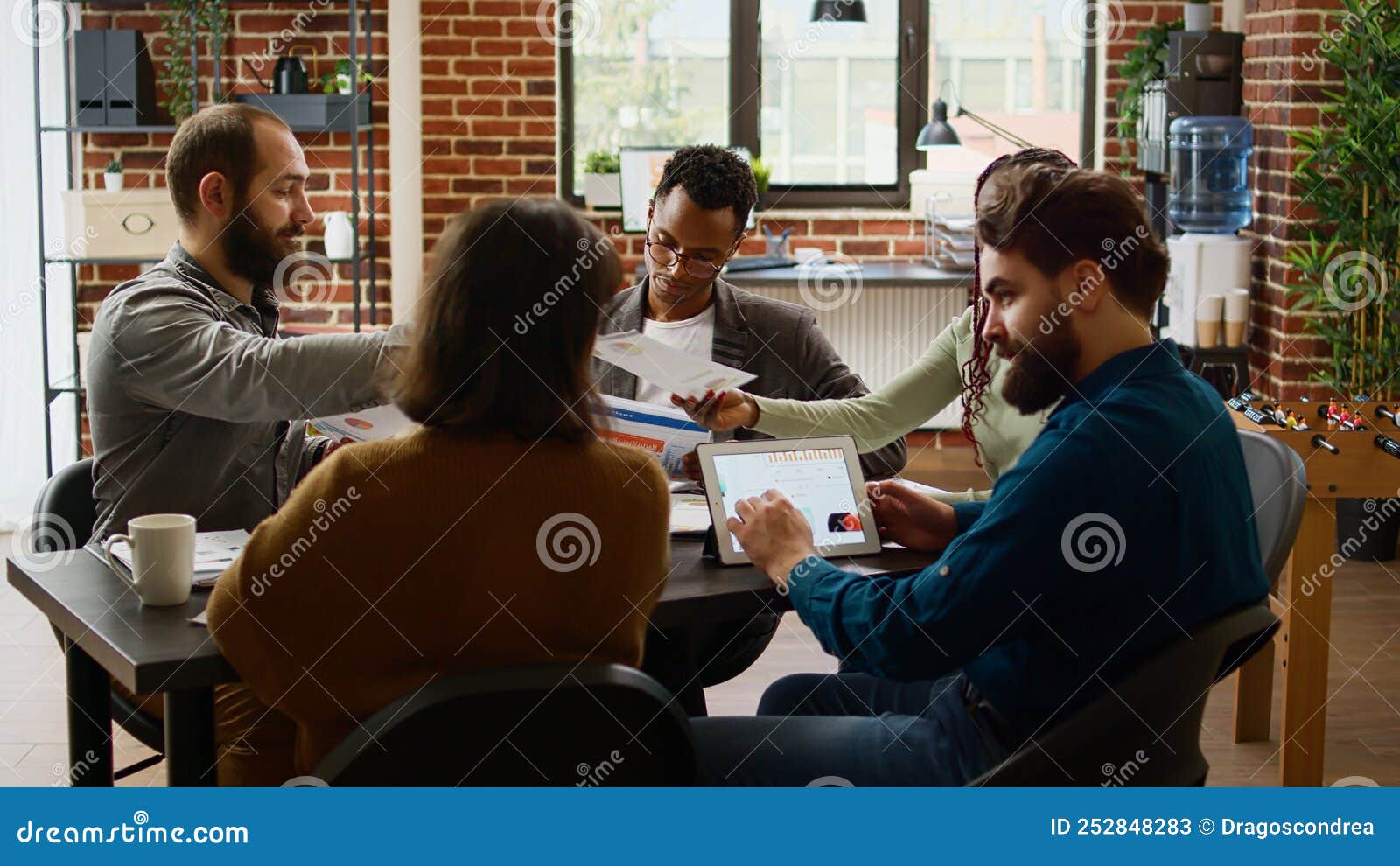 Multiethnic Group of Colleagues Brainstorming Ideas To Plan Report ...