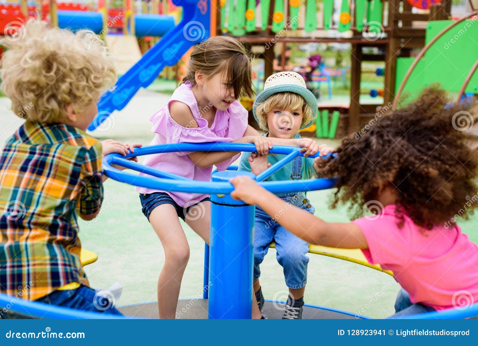Multiethnic Group of Little Kids Riding on Carousel Stock Image - Image ...