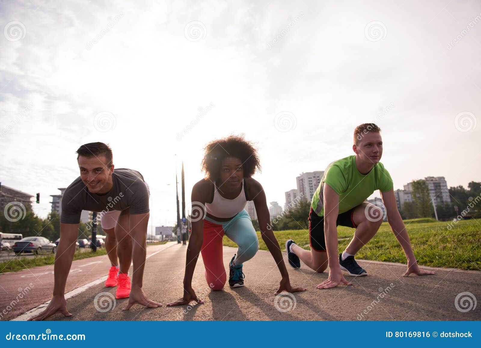 Multiethnic Group of People on Start Position for Jogging Stock Photo ...