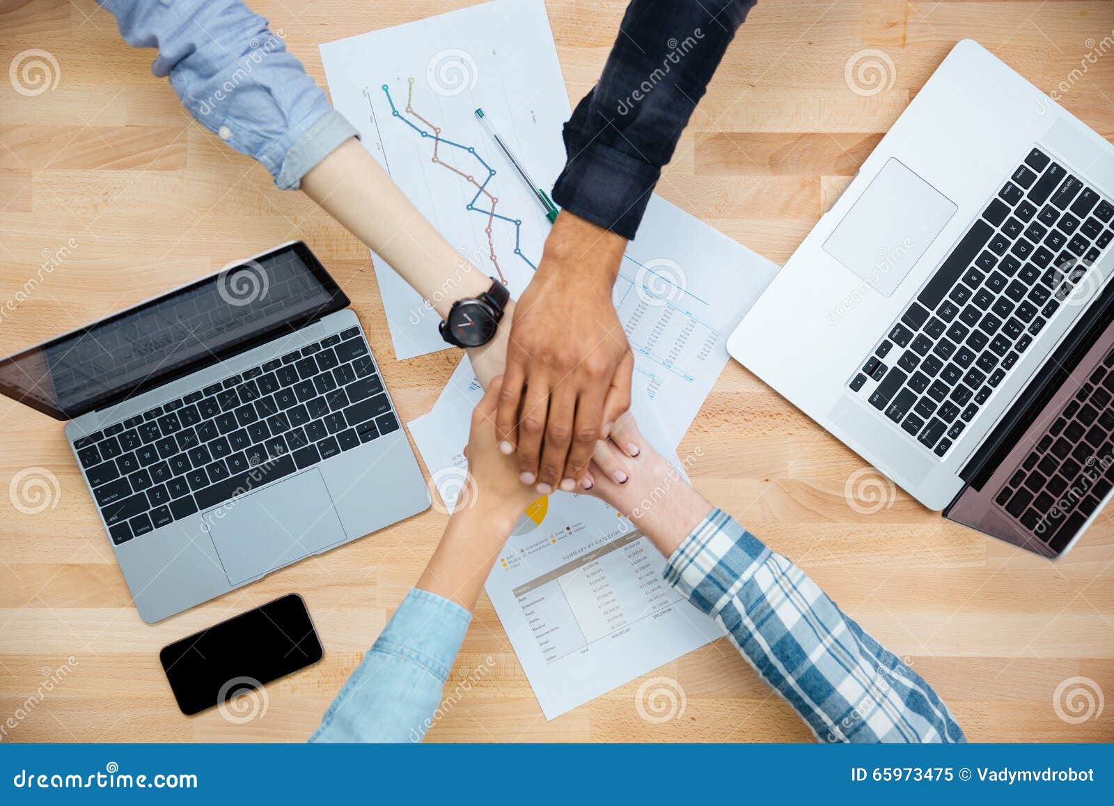 Multiethnic Group of People Working and Joining Hands Together Stock ...