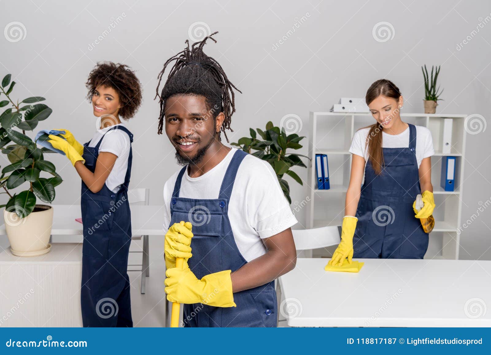 Multiethnic Group of Professional Cleaners in Rubber Gloves Smiling at ...