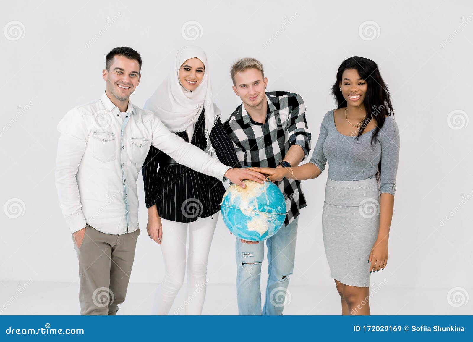 Multiethnic Group of Young People Holding Hands on the Earth Globe and ... Multiethnic Group of Young People Holding Hands on the Earth Globe and ...