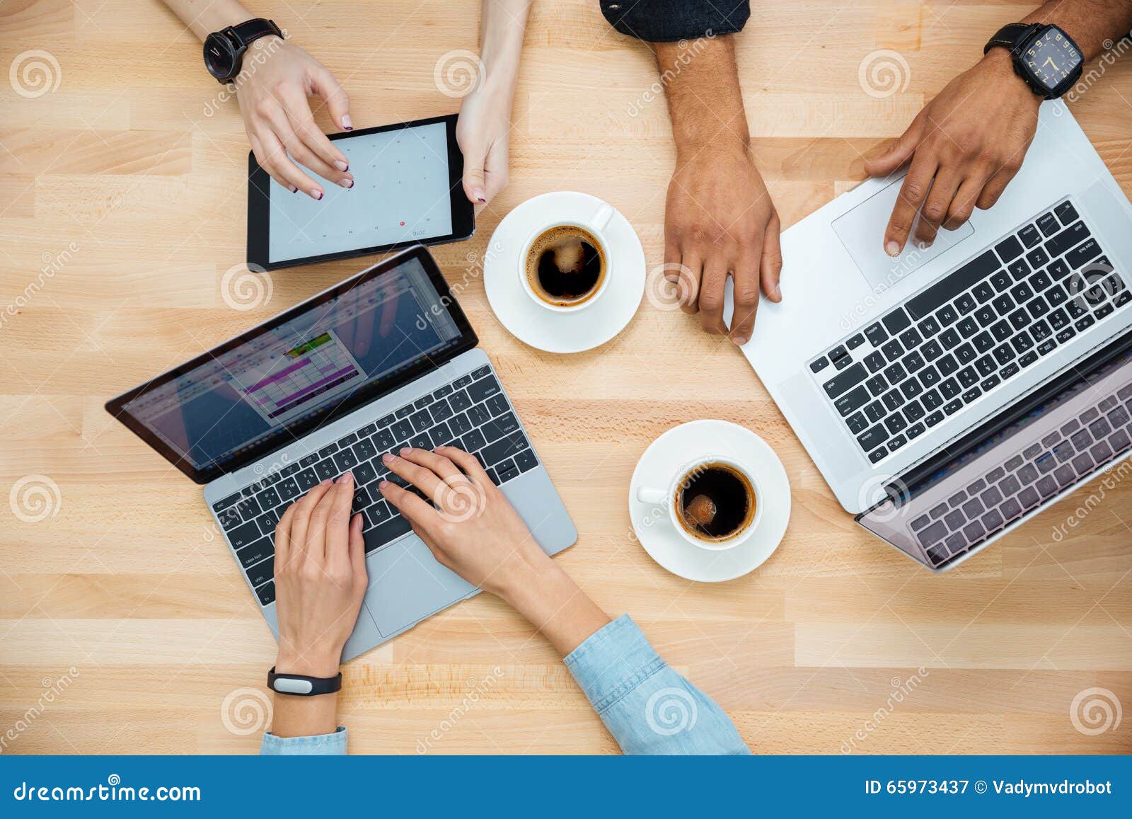 Multiethnic Group of Young People Using Laptops and Drinking Coffee ...