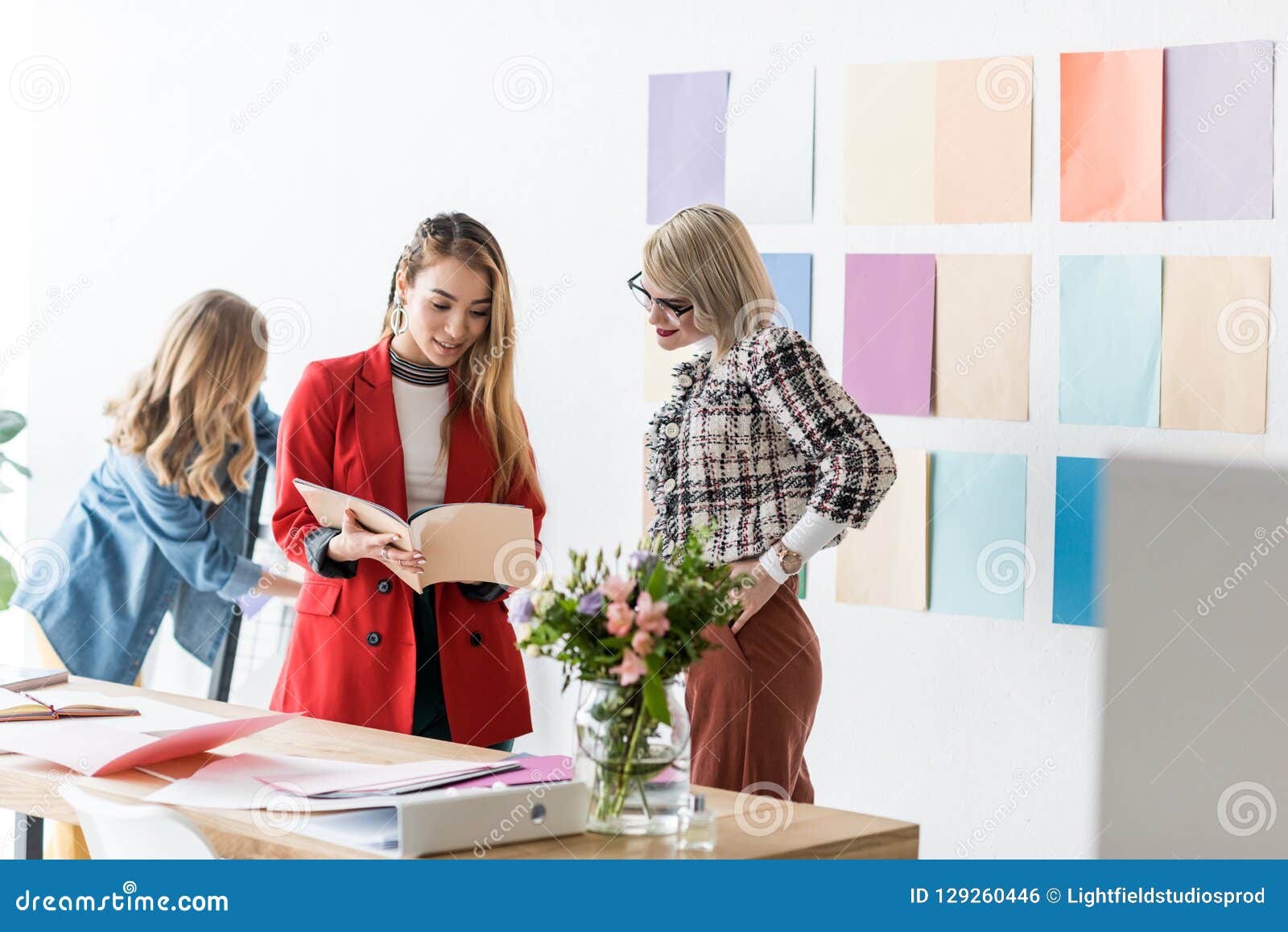 Multiethnic Magazine Editors Working with Documents in Modern Stock ...