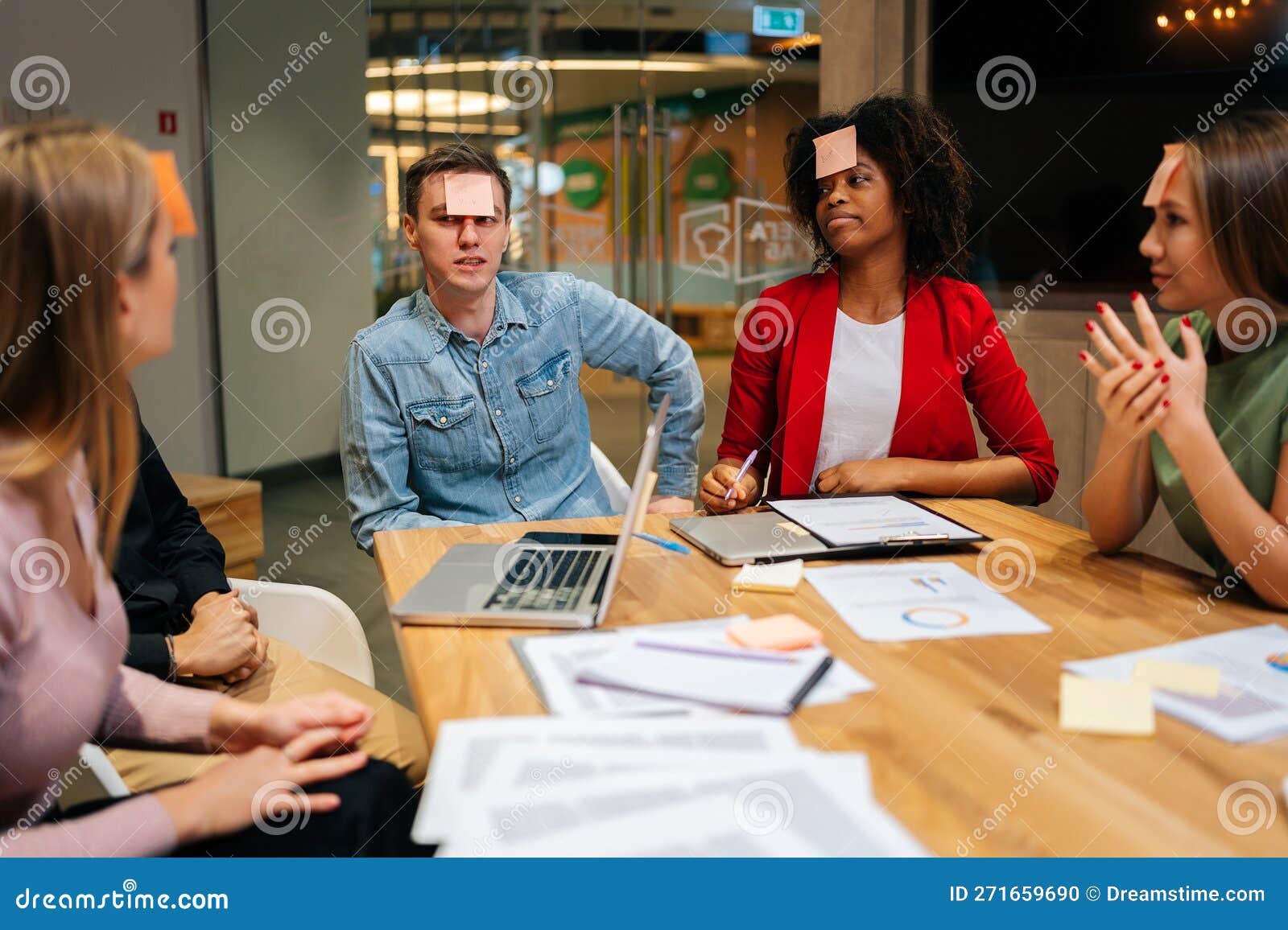 Multiethnic Startup Team Playing Guessing Game with Sticky Notes on ...