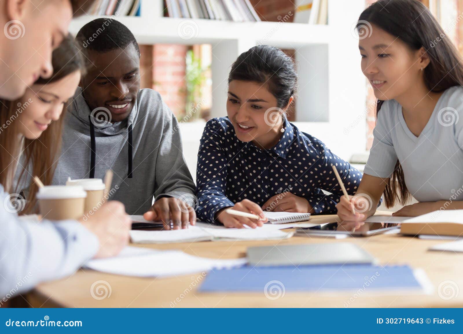 Multiethnic Students Work on Group Project in Classroom Stock Image ...