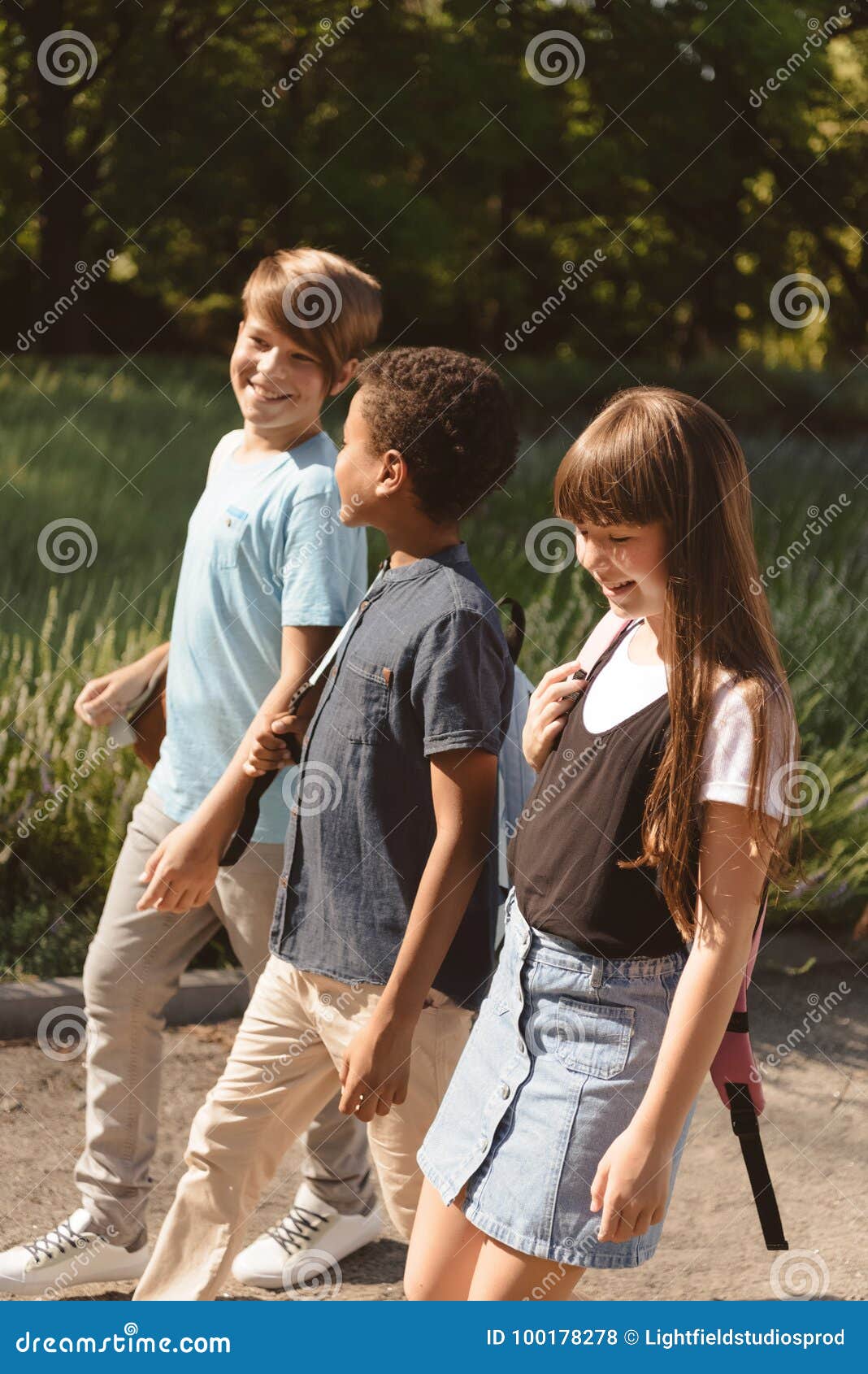 Multiethnic Teens Walking in Park Stock Photo - Image of nature, people ...
