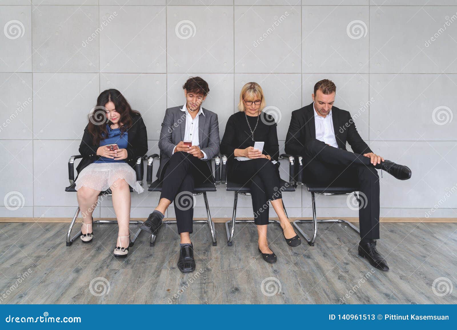 Multiethnic Work Applicants Busy Using Laptops and Smartphones ... Multiethnic Work Applicants Busy Using Laptops and Smartphones ...