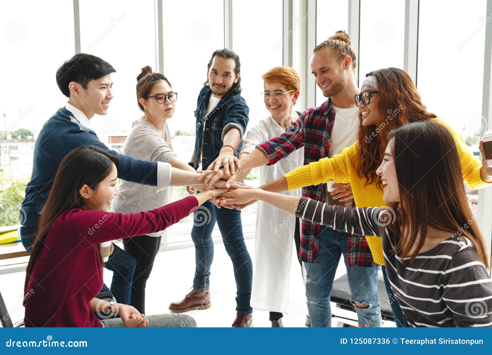 Multiethnic Young Team Stack Hands Together As Trusted Unity and ...