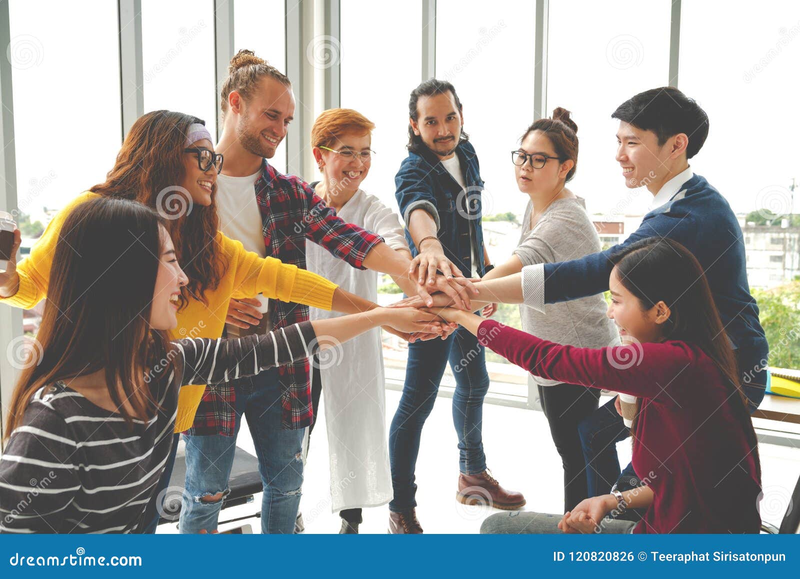 Multiethnic Young Team Stack Hands Together As Unity and Teamwork in ...