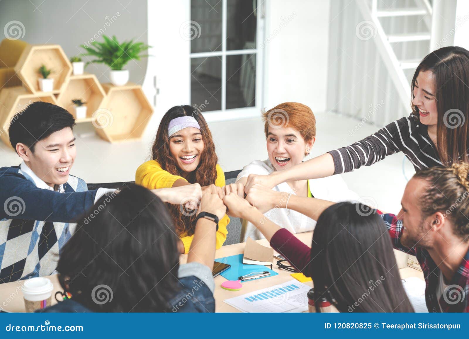 Multiethnic Young Team Stack Hands Together As Unity And Teamwork In ...