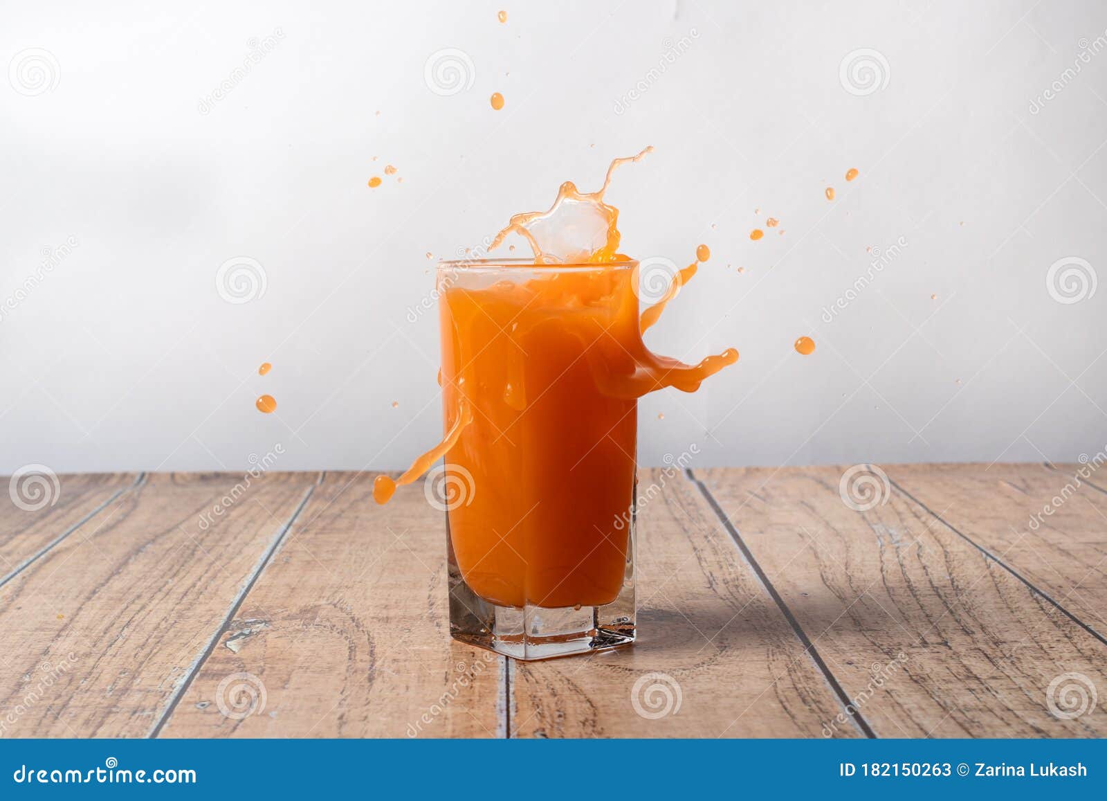 Multifruit Tropical Orange Juice is Sprayed and Splashed Out of a Glass ...