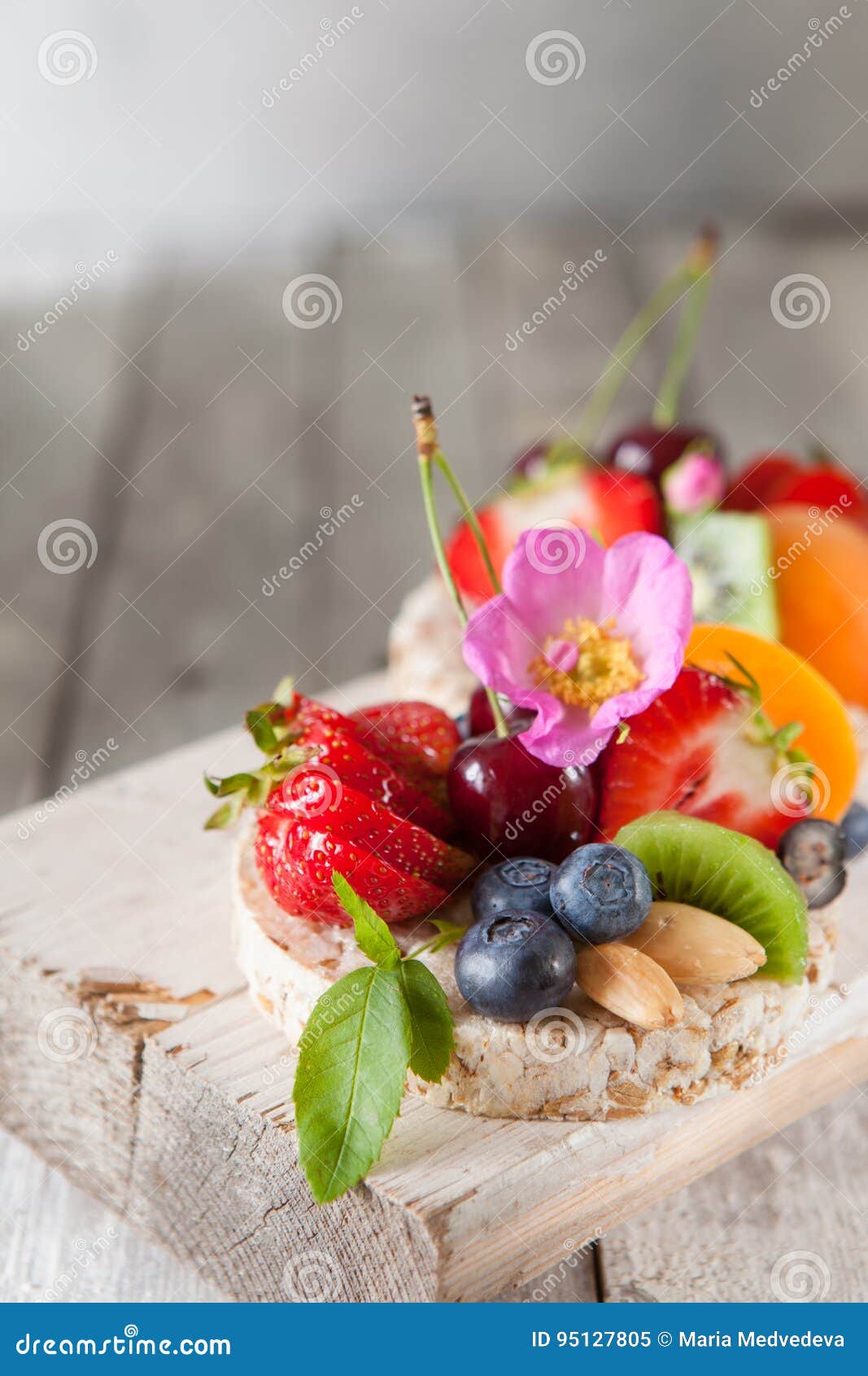 Multigrain Rice Cakes with Berries, Fruit and Almond for Healthy Stock ...