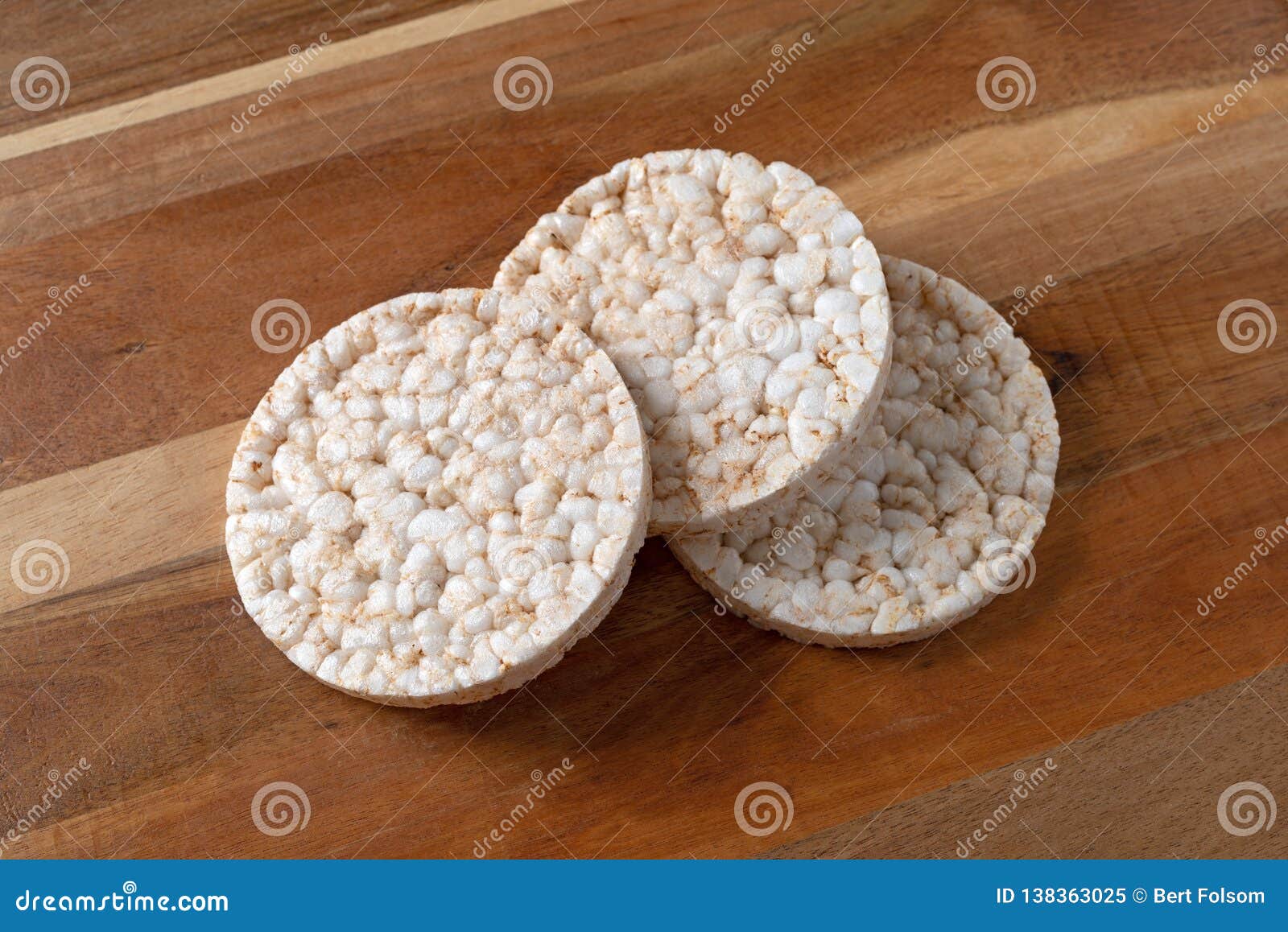 Multigrain Rice Cakes on Wood Cutting Board Stock Image - Image of ...