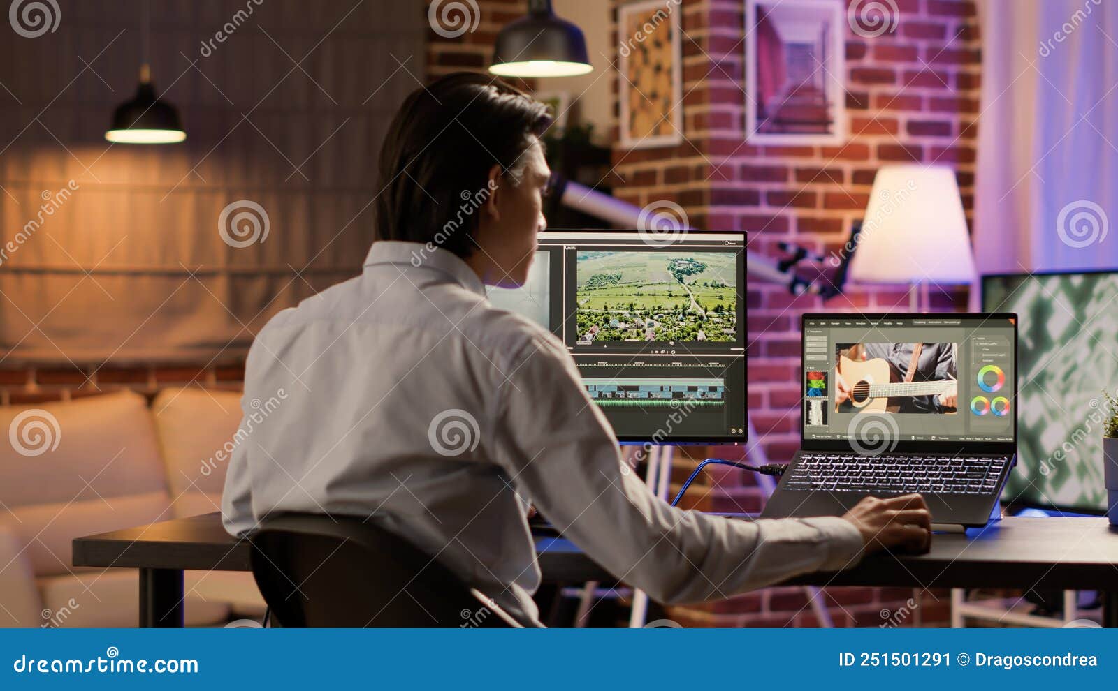 Multimedia Artist Editing Video Montage with Sound and Visual Effects ...