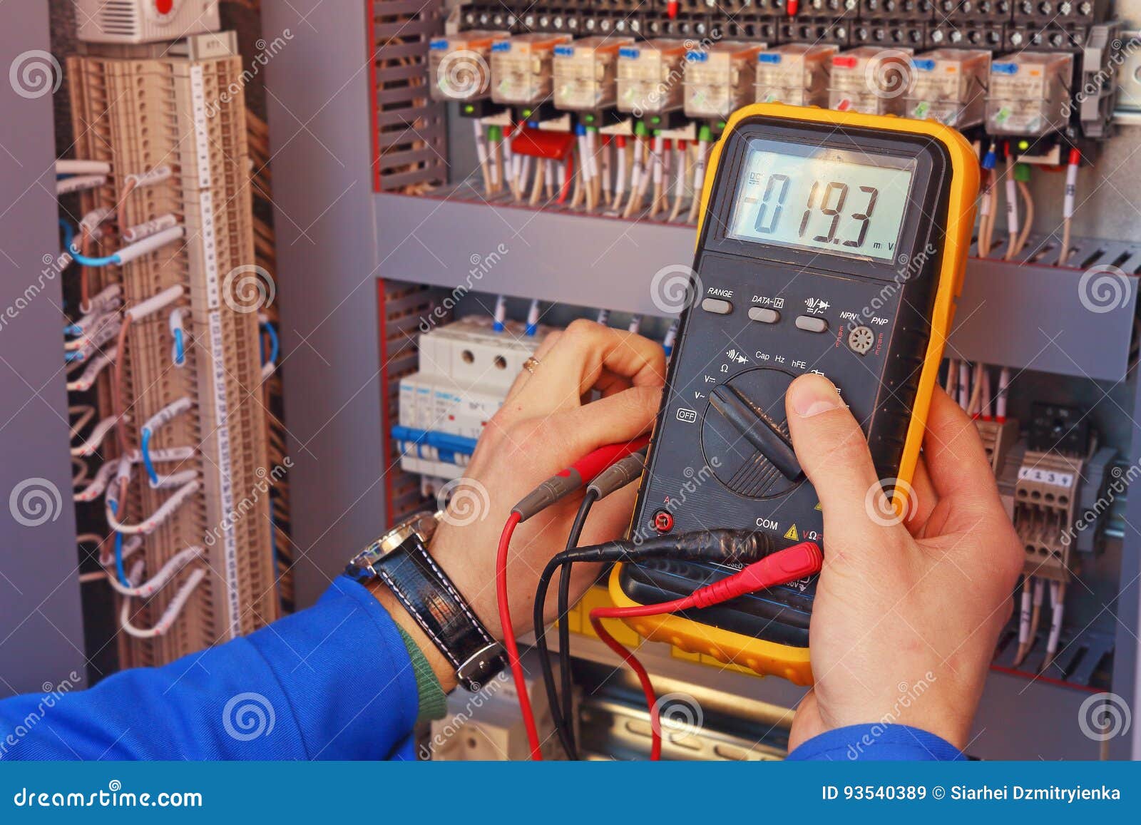 Multimeter in the Hands of an Electrician Close-up on a Blurred ...